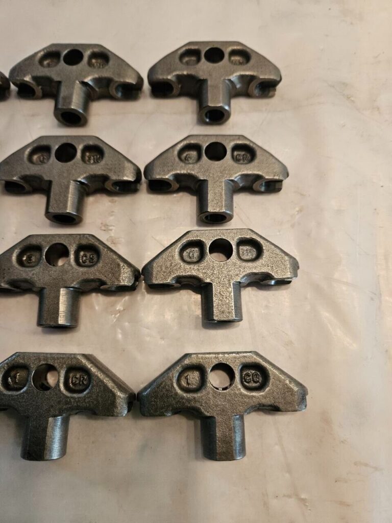 Set of 12 PACCAR MX13 diesel engine crosshead rocker arm valve bridges G319 OEM - ABC Diesel Parts