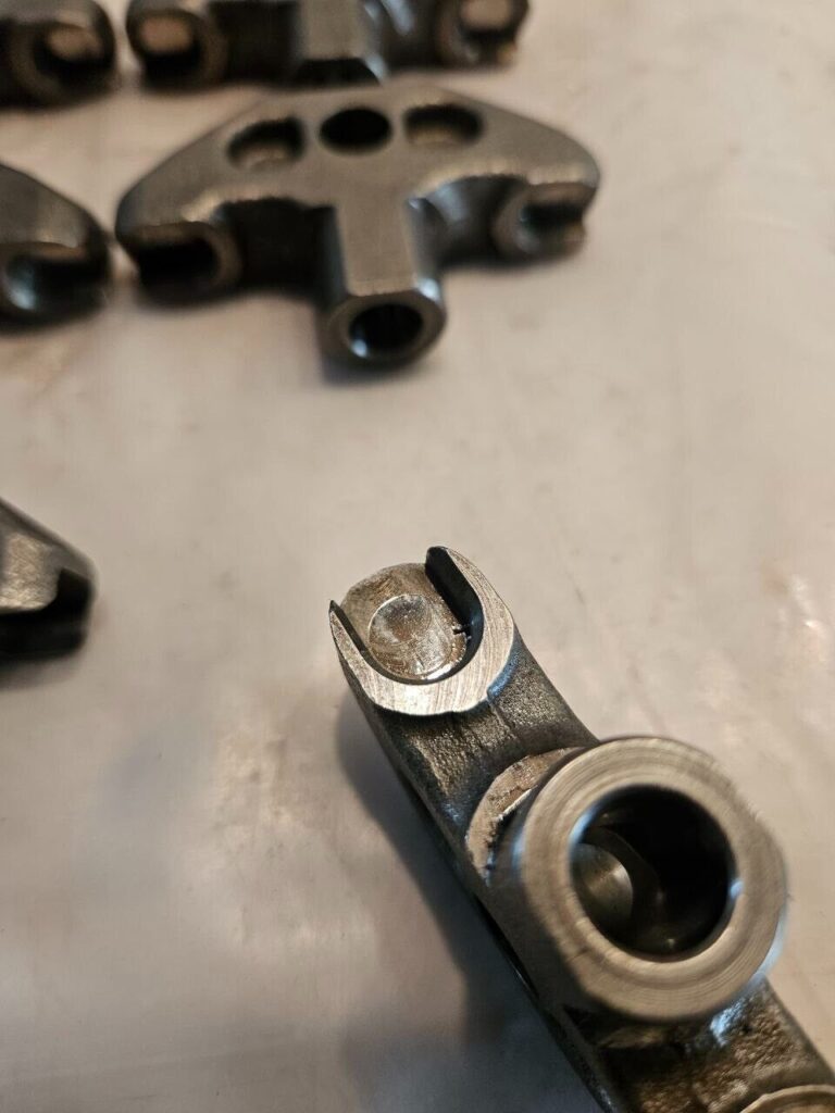 Set of 12 PACCAR MX13 diesel engine crosshead rocker arm valve bridges G319 OEM - ABC Diesel Parts